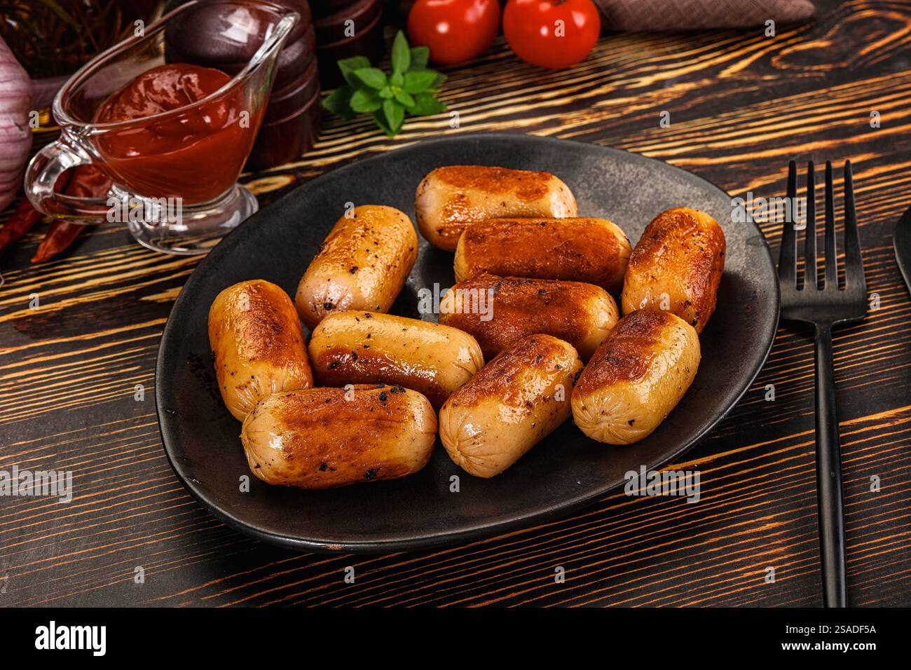 Roasted chicken mini sausages for breakfast in the bowl Stock Photo - Alamy
