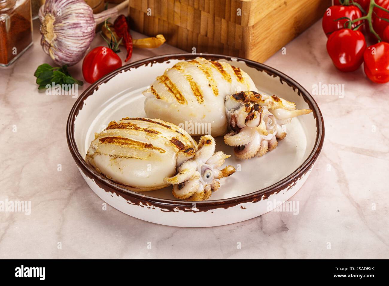 Grilled gourmet cuttlefish in the plate Stock Photo - Alamy