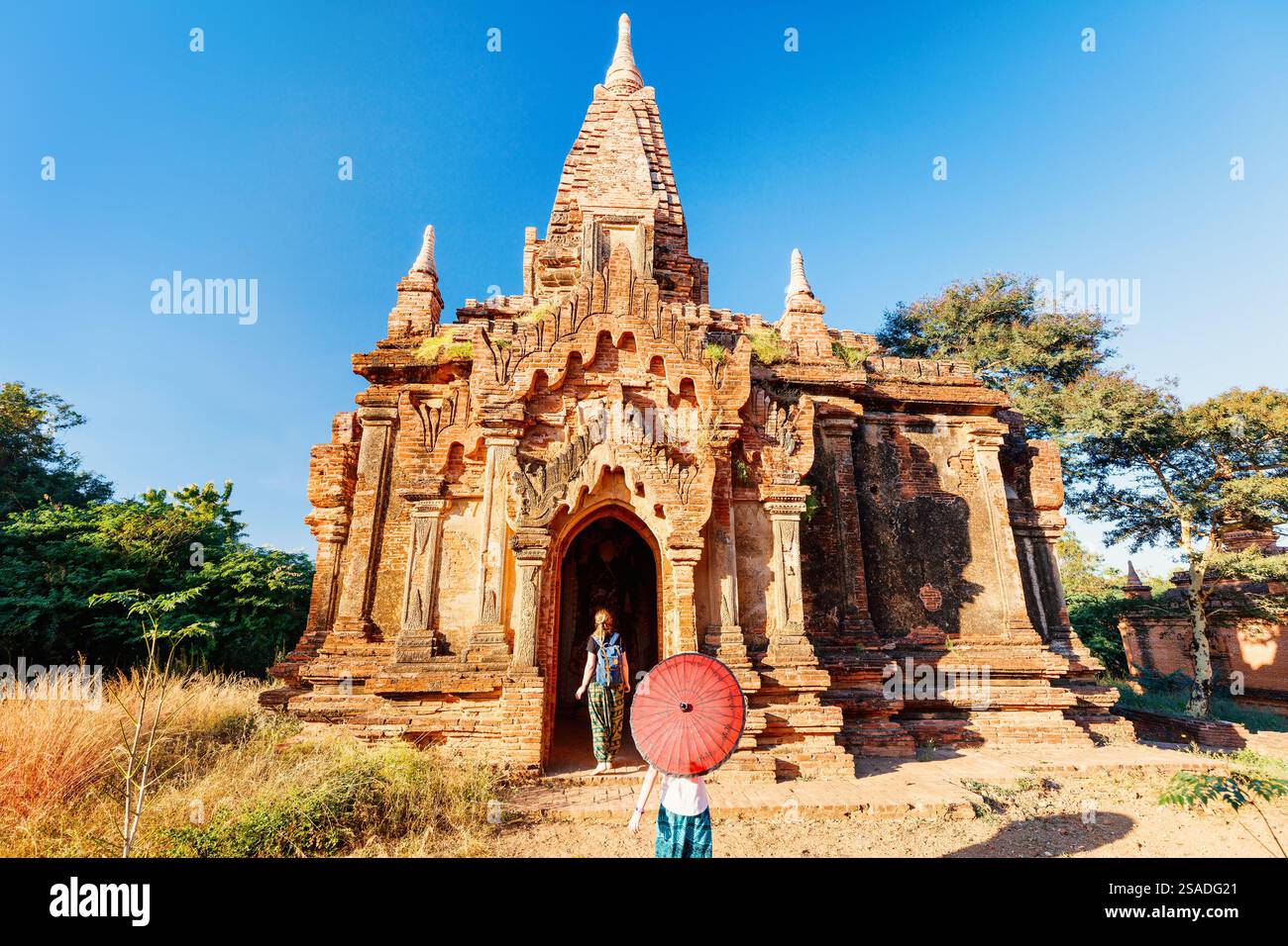 Family of mother and daughter visiting ancient temple in Bagan ...