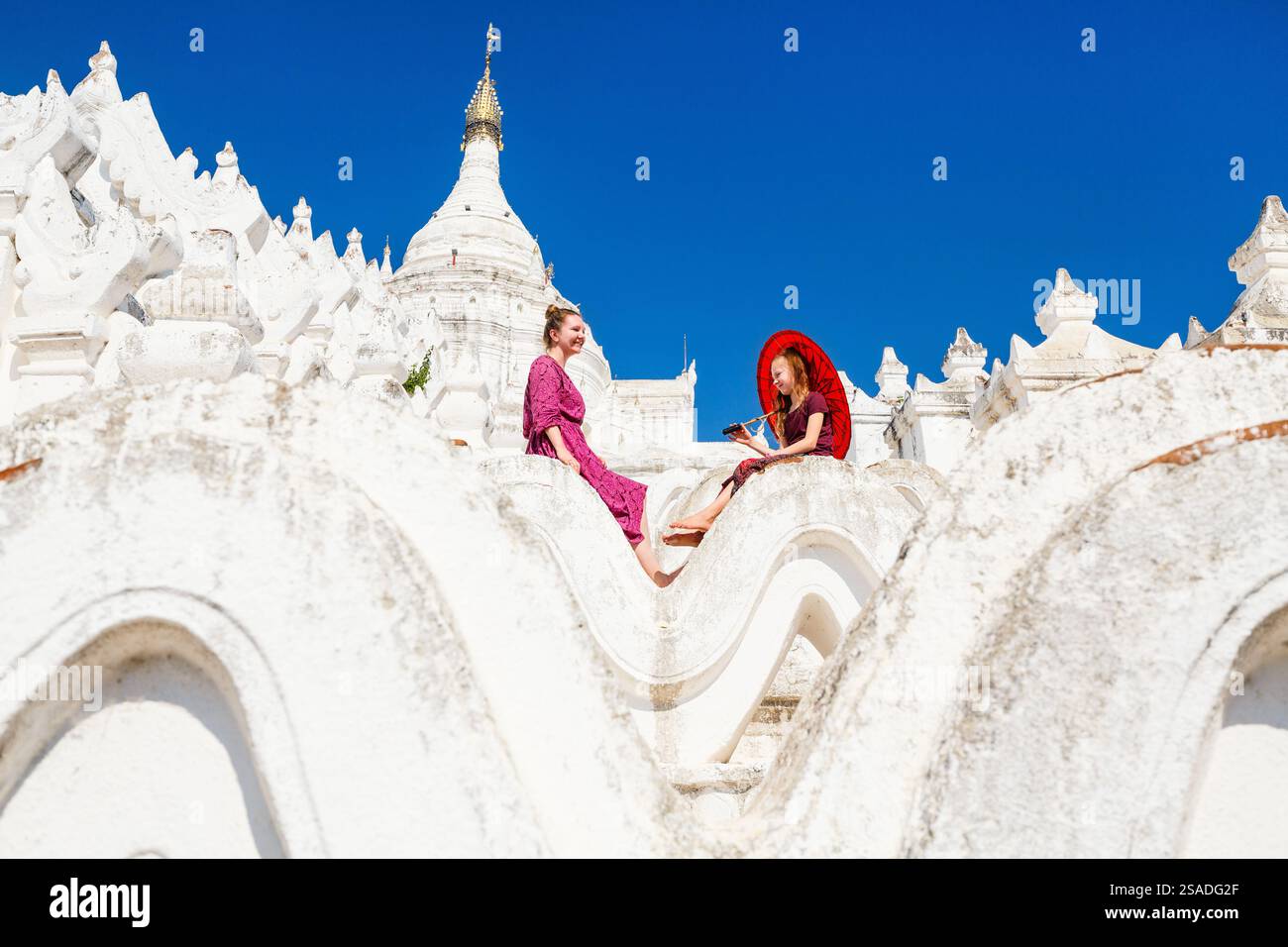 Family of mother and daughter enjoying visit to beautiful white ...