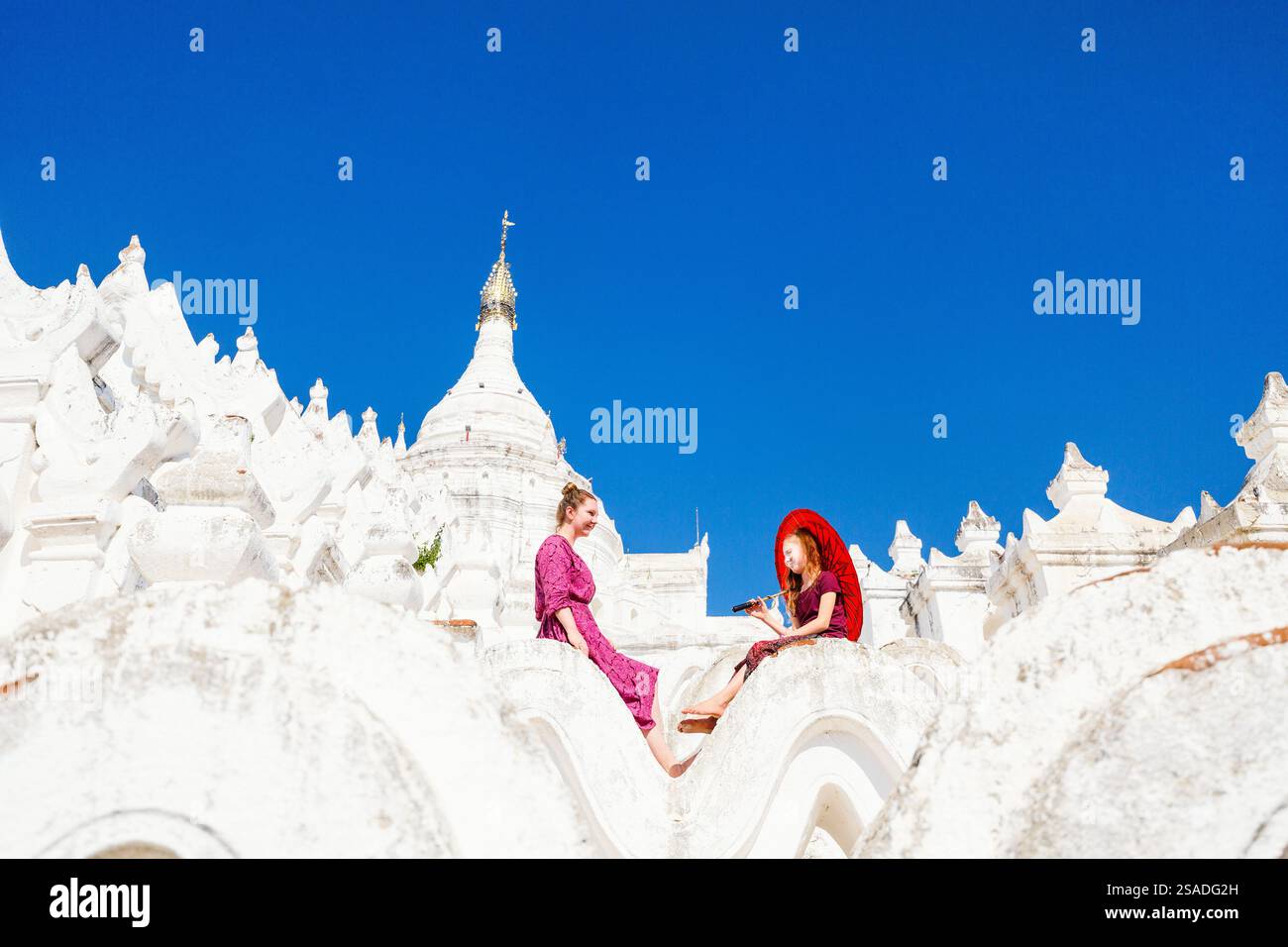 Family of mother and daughter enjoying visit to beautiful white ...