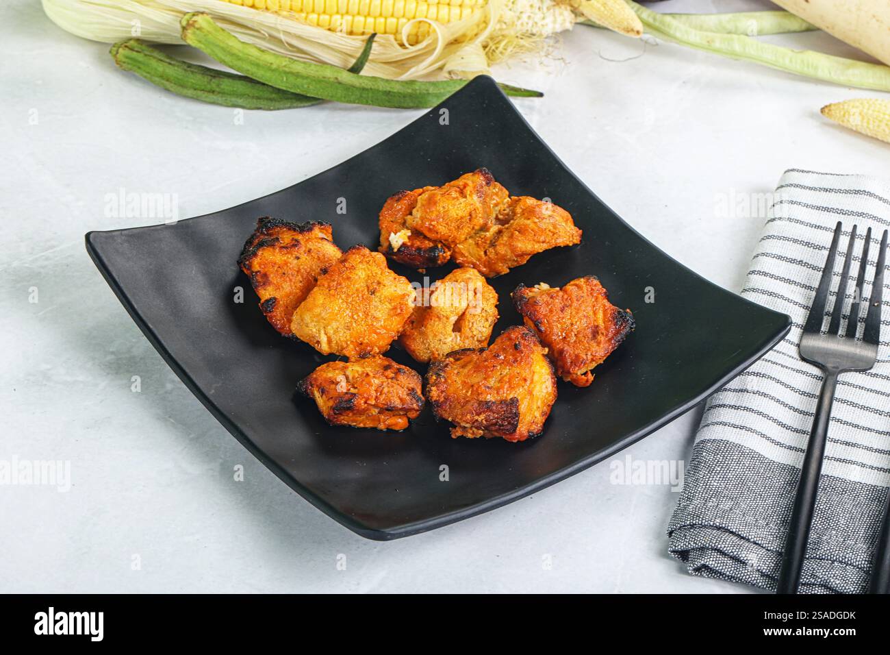 Indian cuisine - Fish Tikka barbecue with spices Stock Photo - Alamy