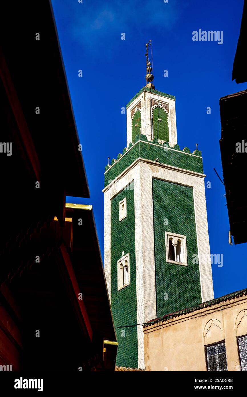 Great mosque minaret towering over Meknes medina, Morocco Stock Photo ...