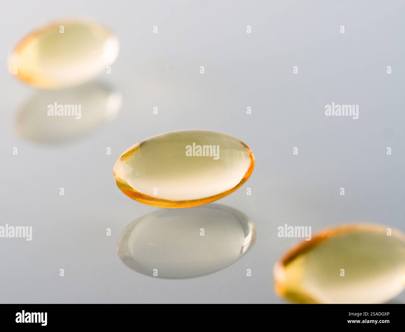 Omega 3 fish oil supplement capsule in group isolated on white ...