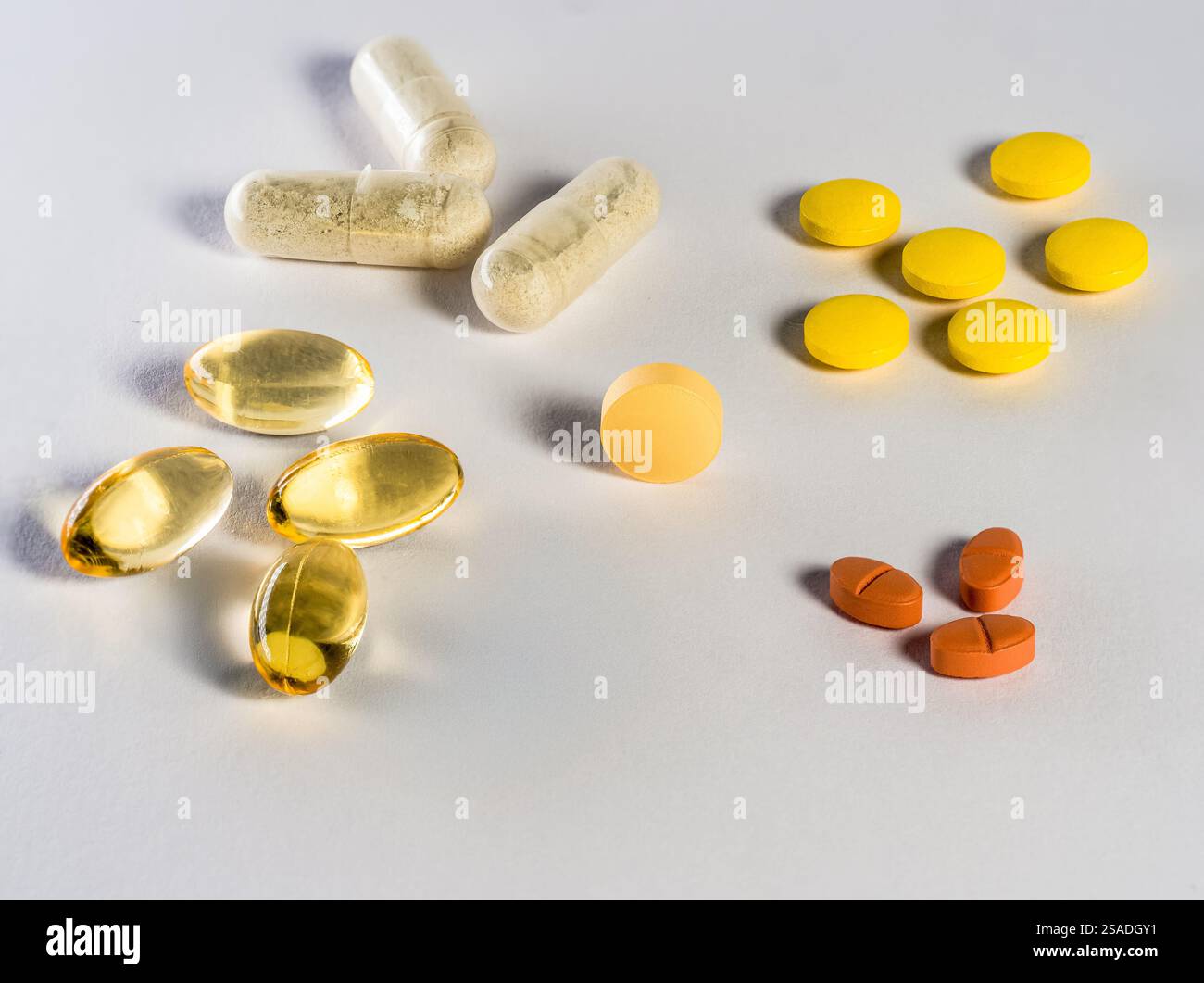 vitamin tablets, various colors; omega 3, in health support group ...