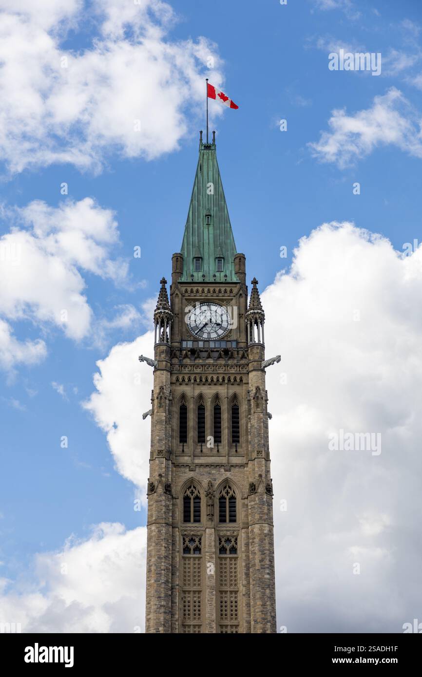 Parliament building with Canadian flag in Ottawa, Canada. Peace tower ...