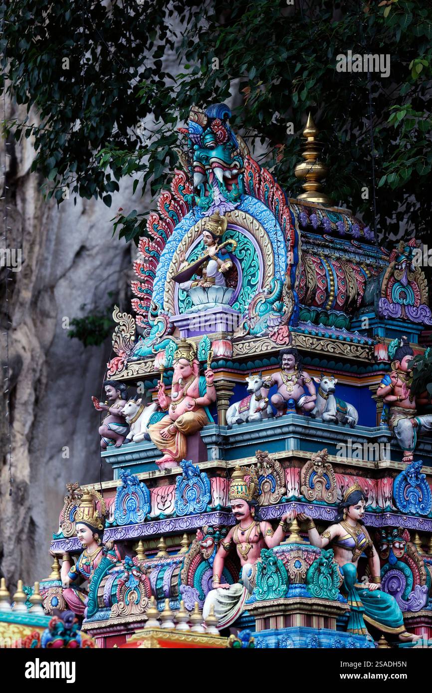 Hindu temple and shrine of Batu Caves. Colorful statues of various ...