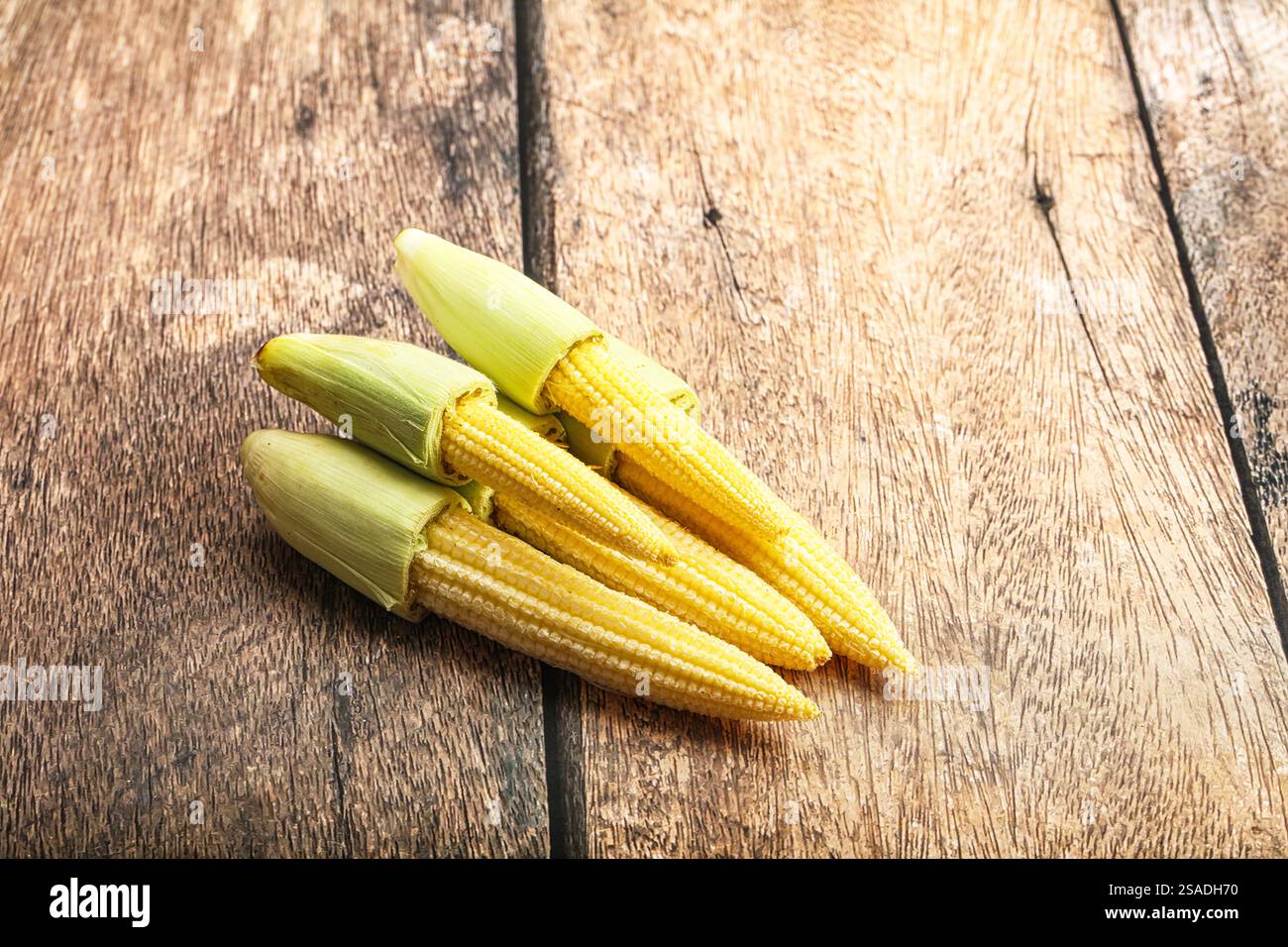 Small young sweet baby corn heap Stock Photo - Alamy