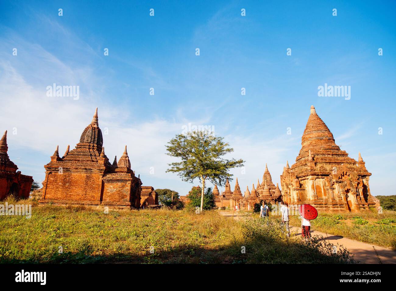 Back view family of mother and kids visiting ancient temples in Bagan ...