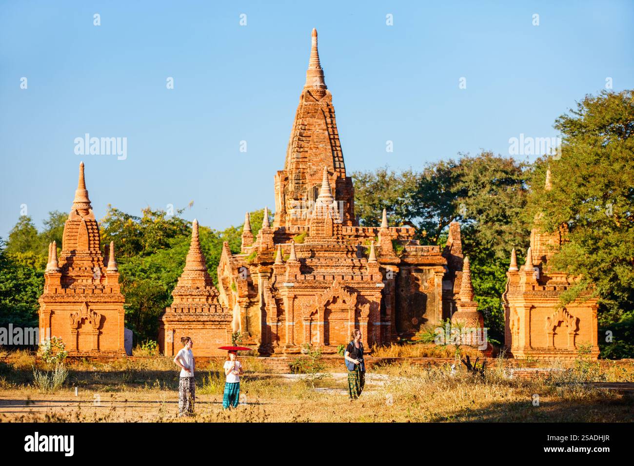 Family mother and kids visiting ancient temples in Bagan Archeological ...