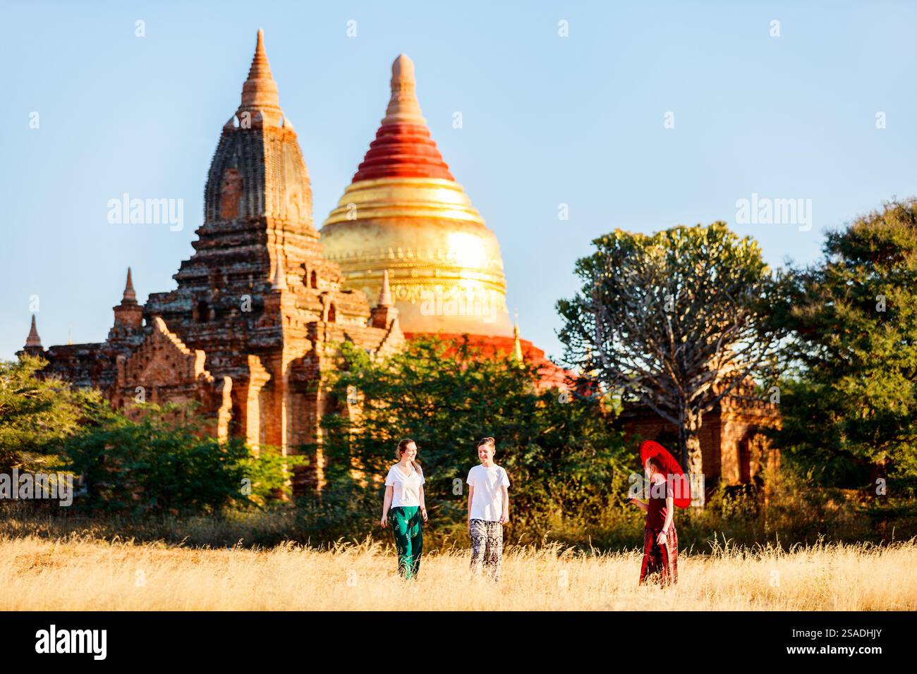 Family of mother and kids visiting Dhammayazika Pagoda and ancient ...