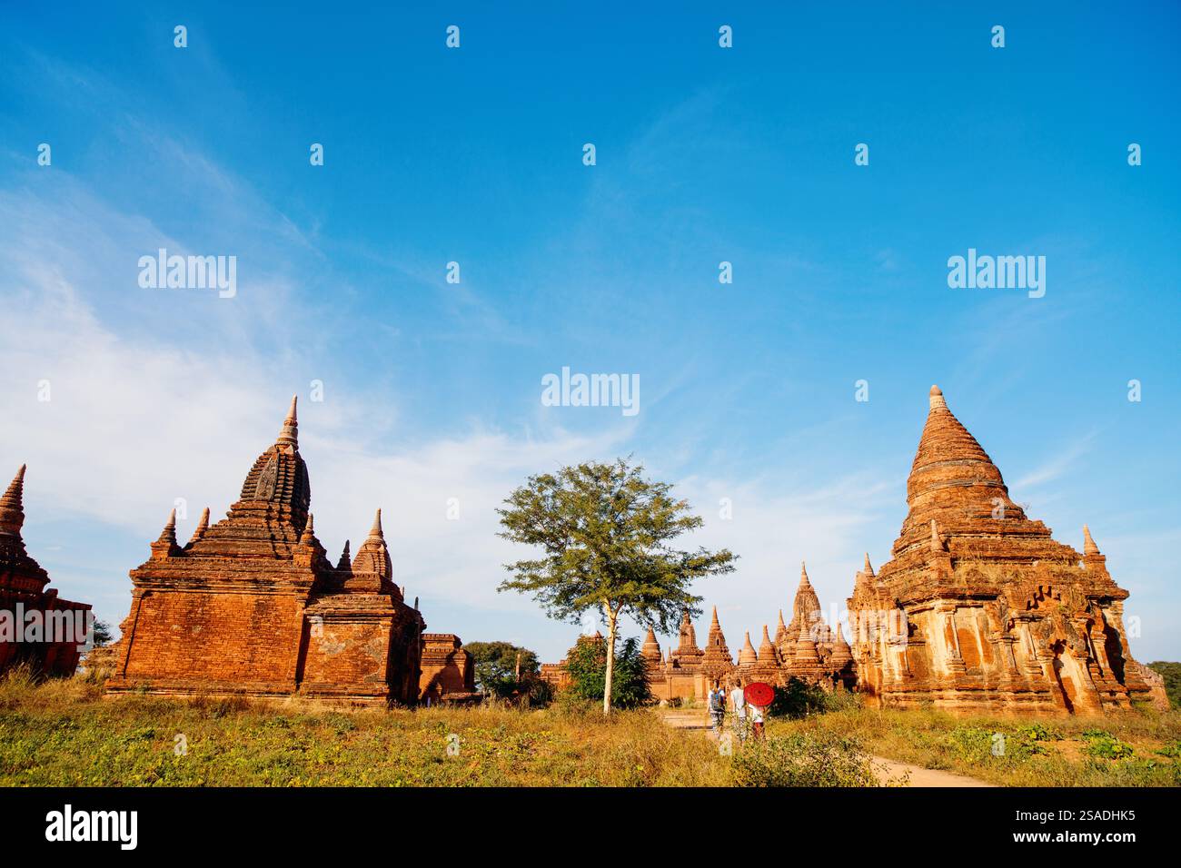 Back view family of mother and kids visiting ancient temples in Bagan ...