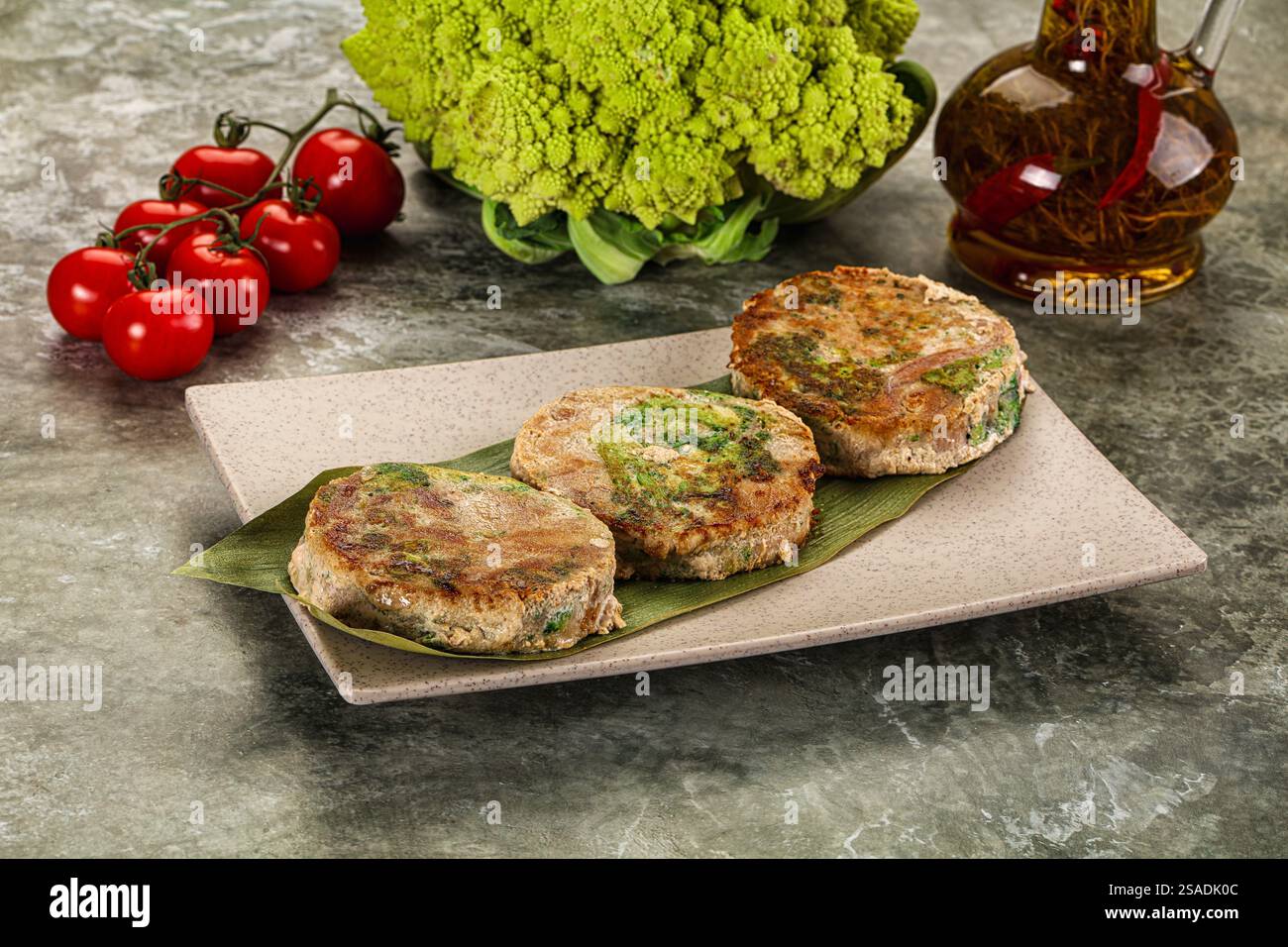 Roasted tuna medallion with broccoli cabbage Stock Photo - Alamy