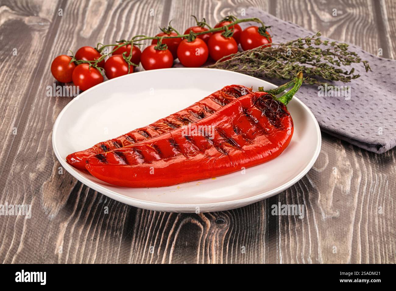 Grilled whole red paprika ramiro pepper Stock Photo - Alamy