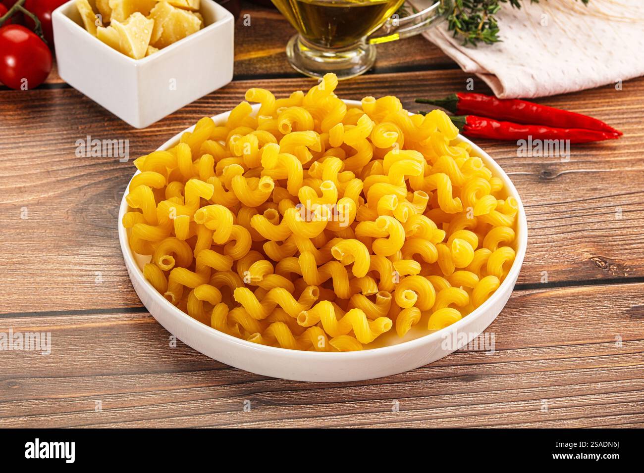 Italian cuisine - dry cellentani pasta for cooking Stock Photo - Alamy