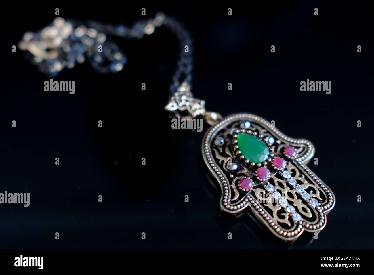 Hamsa hand or hand of Fatima. Religious symbol on a rock. Islam. Kuala ...