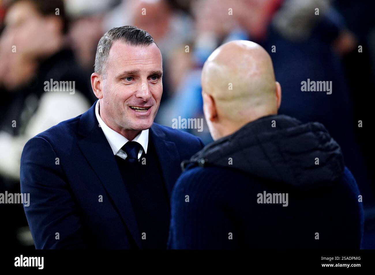 Club Brugge’s manager Nicky Hayen (left) greets Manchester City manager ...