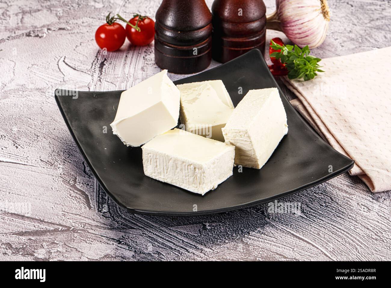 Greek traditional cuisine - Feta cheese bricks Stock Photo - Alamy