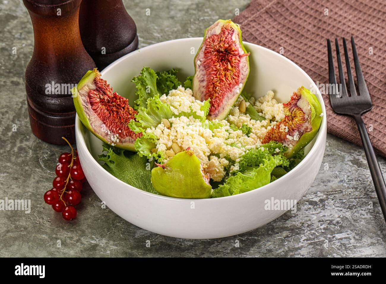 Salad with fig and sheep cottage cheese Stock Photo - Alamy