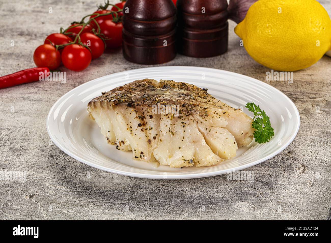 Dietary Baked cod fish fillet with spices Stock Photo - Alamy