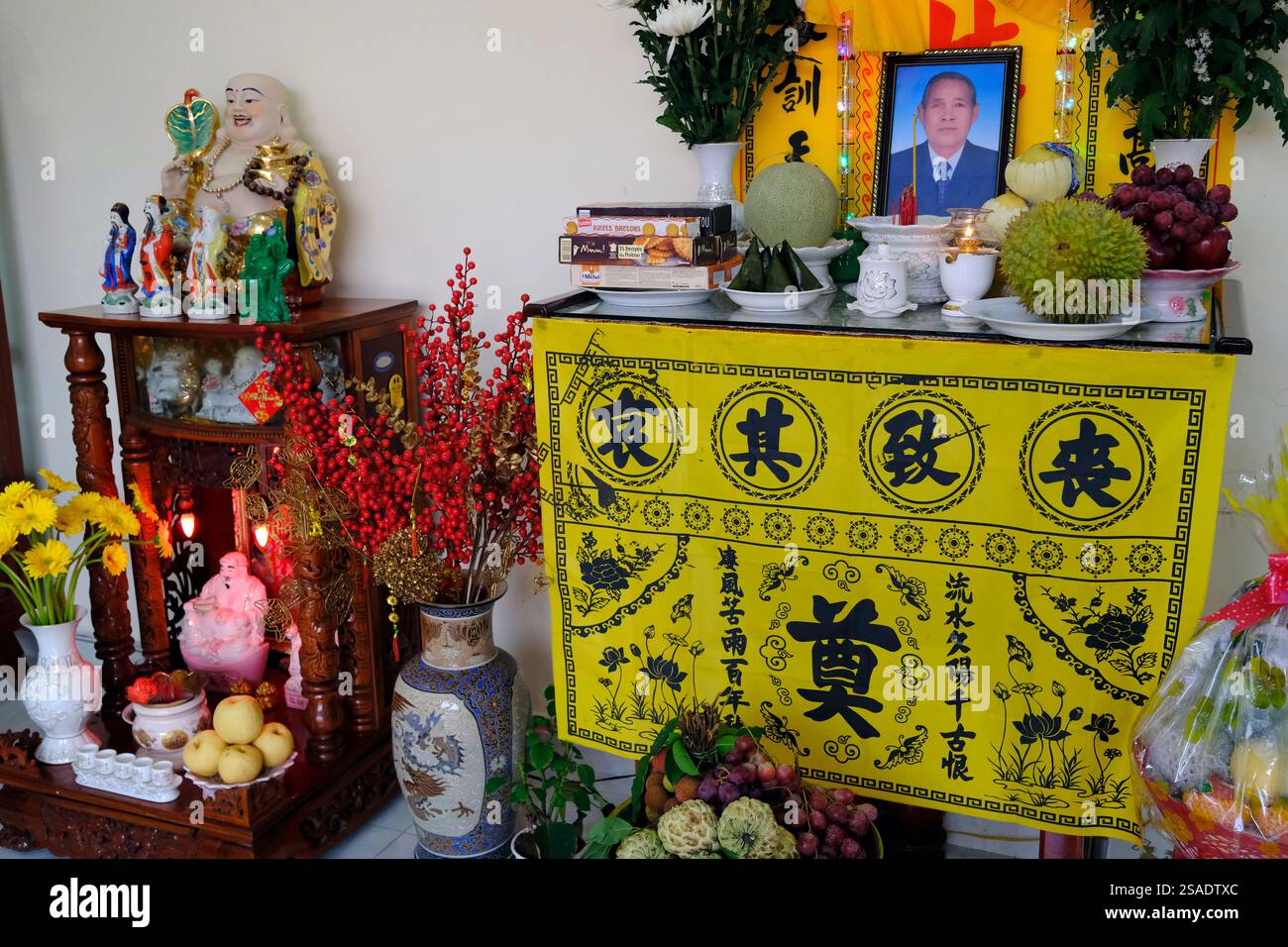 Funeral ceremony in a Buddhist family. Altar of the deceased. Tan Chau ...