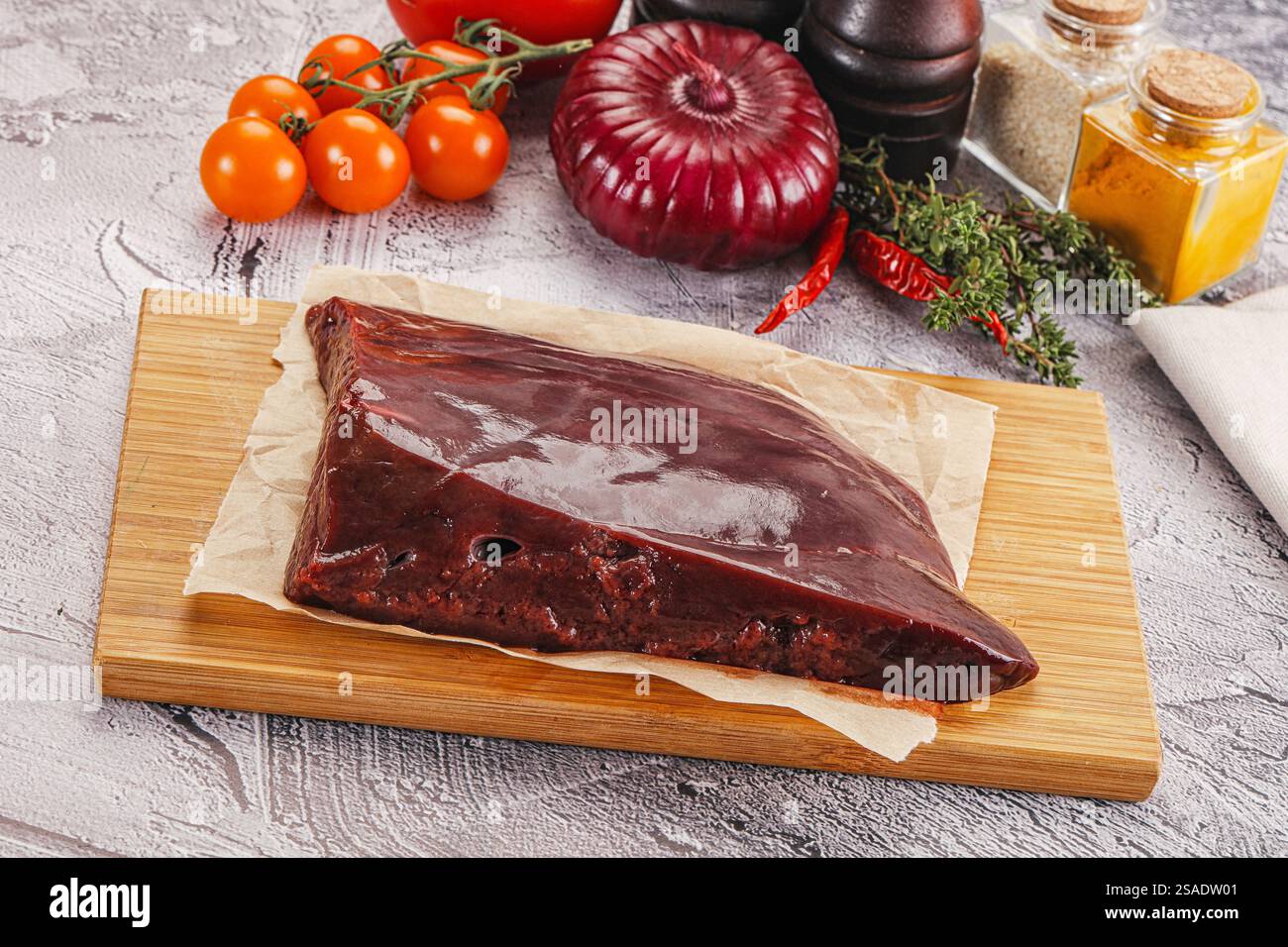 Raw beef liver piece for cooking Stock Photo - Alamy
