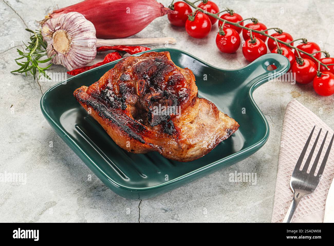 Roasted pork knuckle steak with bone Stock Photo - Alamy