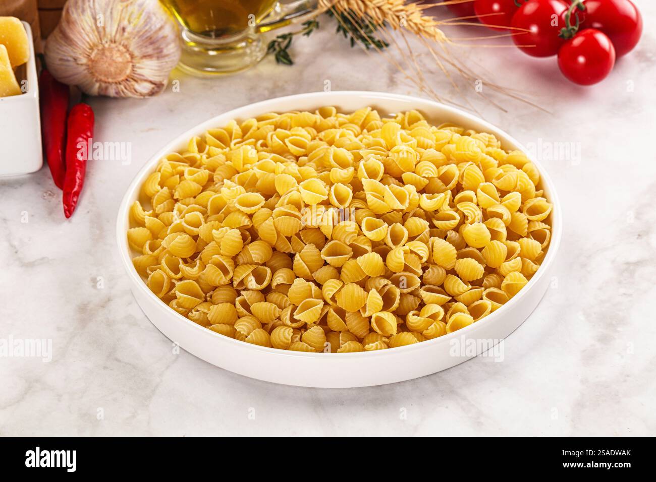 Italian cuisine - dry conchiglie shell pasta Stock Photo - Alamy