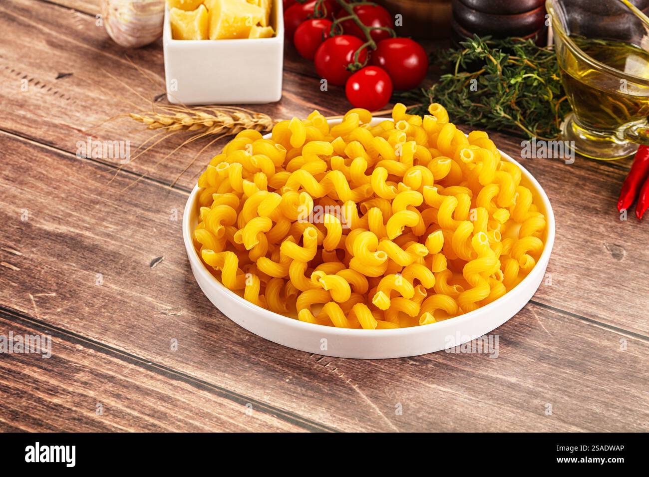Italian cuisine - dry cellentani pasta for cooking Stock Photo - Alamy