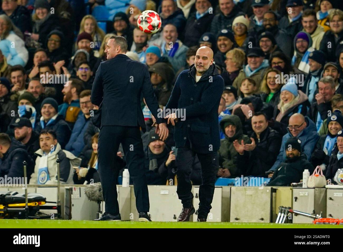 Manchester City's head coach Pep Guardiola, right, and Brugge's head ...