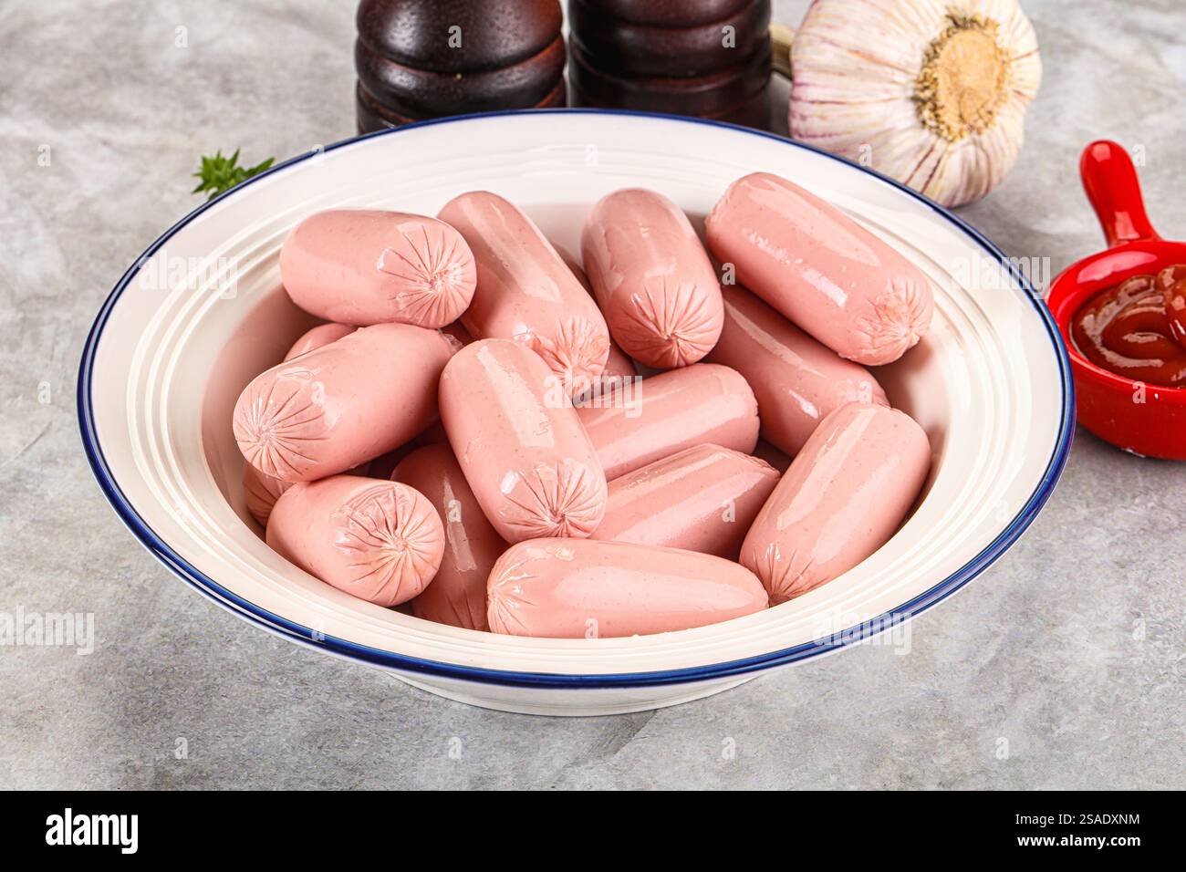 Mini sausages snack for breakfast with sauce Stock Photo - Alamy
