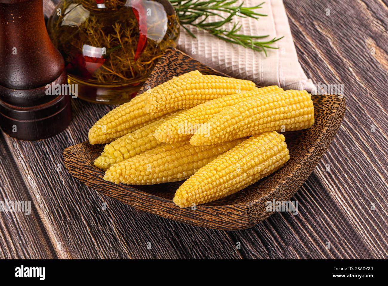 Canned baby mini corn cob in the plate Stock Photo - Alamy
