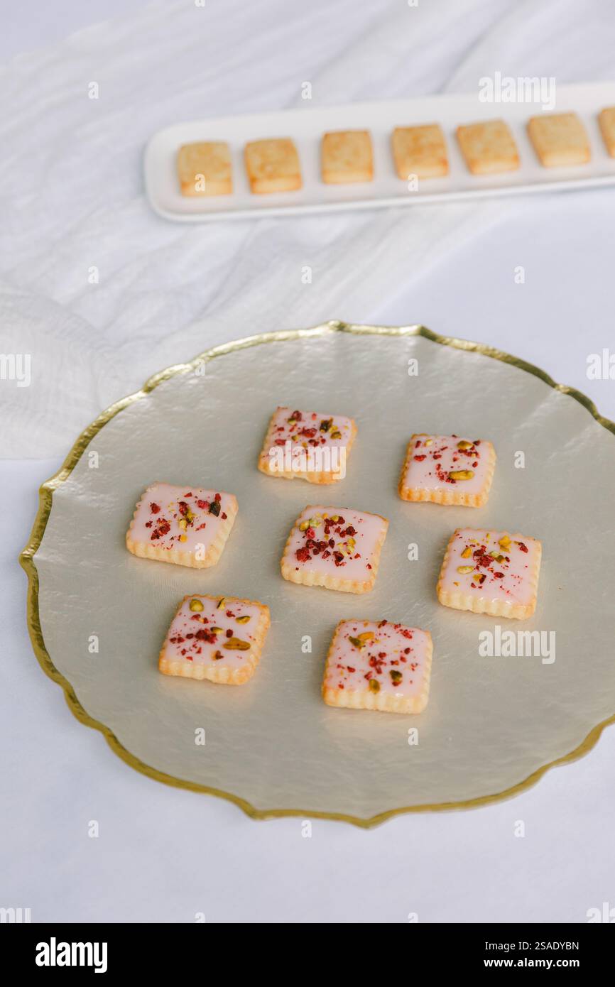 Beautifully arranged shortbread cookies with colorful toppings sit on ...
