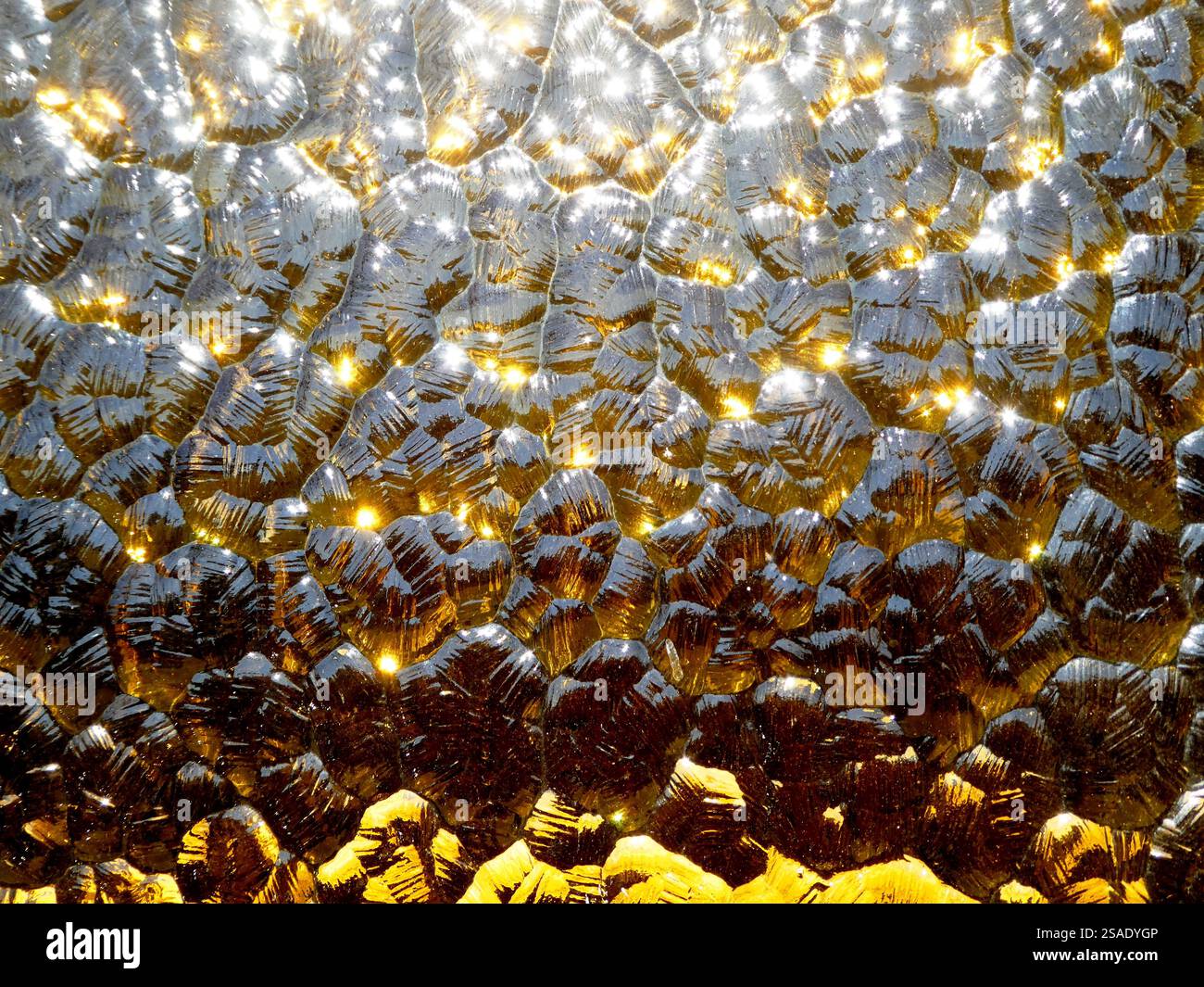 Window panes of textured glass in the afternoon light, a closeup view ...