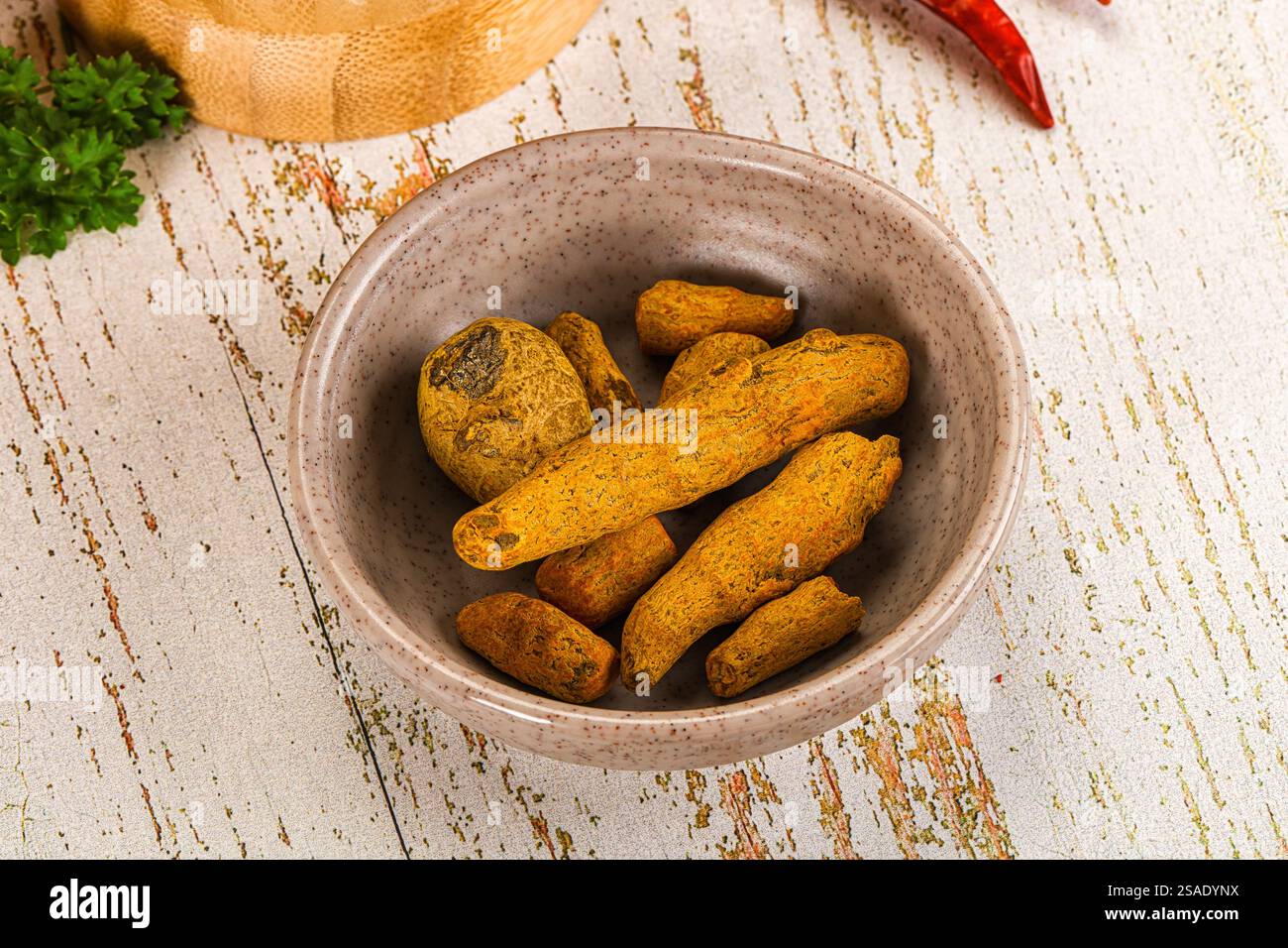 Raw dry Tumeric roots heap for culinary and medicine Stock Photo - Alamy