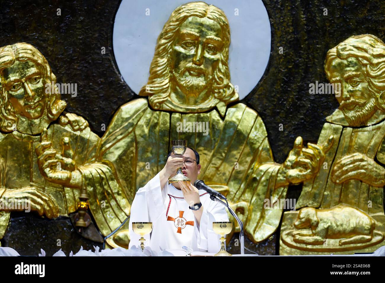 Tan Hoa Church. Sunday catholic mass. Priest celebrating the Eucharist ...