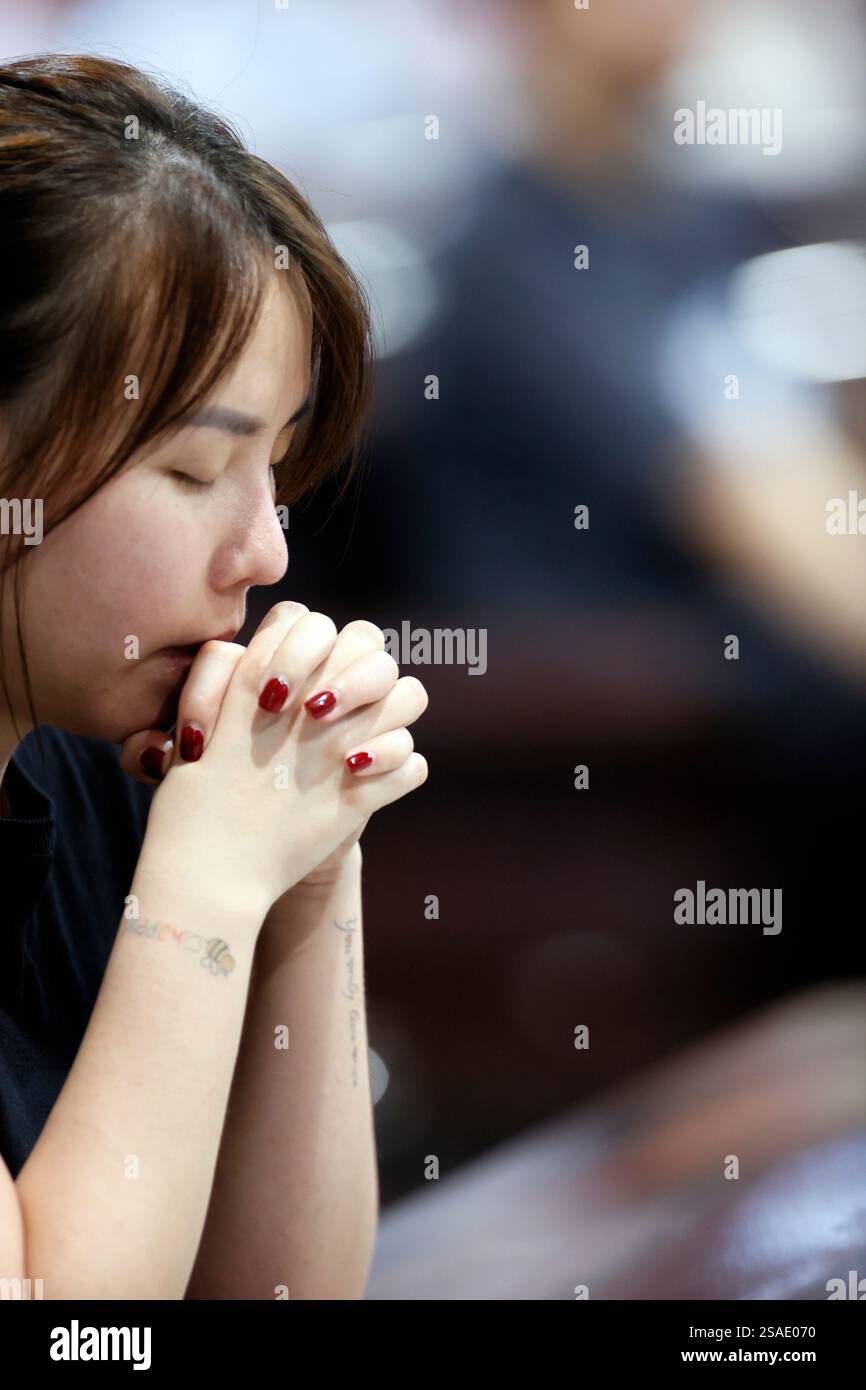 Tan Hoa Church. Sunday catholic mass. Parishioner praying to god. Ho Chi Minh City. Vietnam ...
