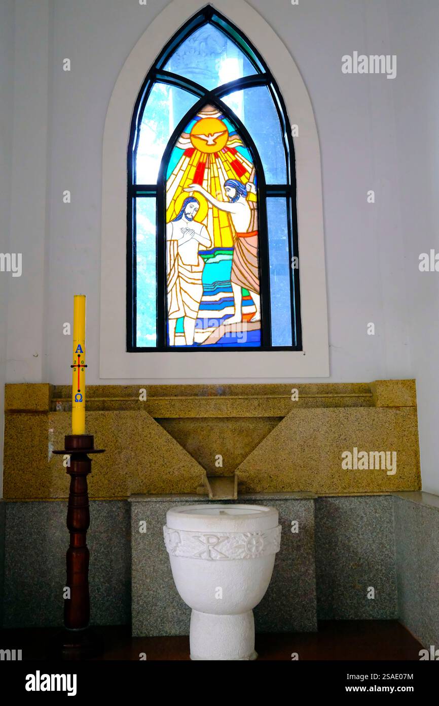 Catholic church. Stained glass window. The baptism of Jesus by John the ...