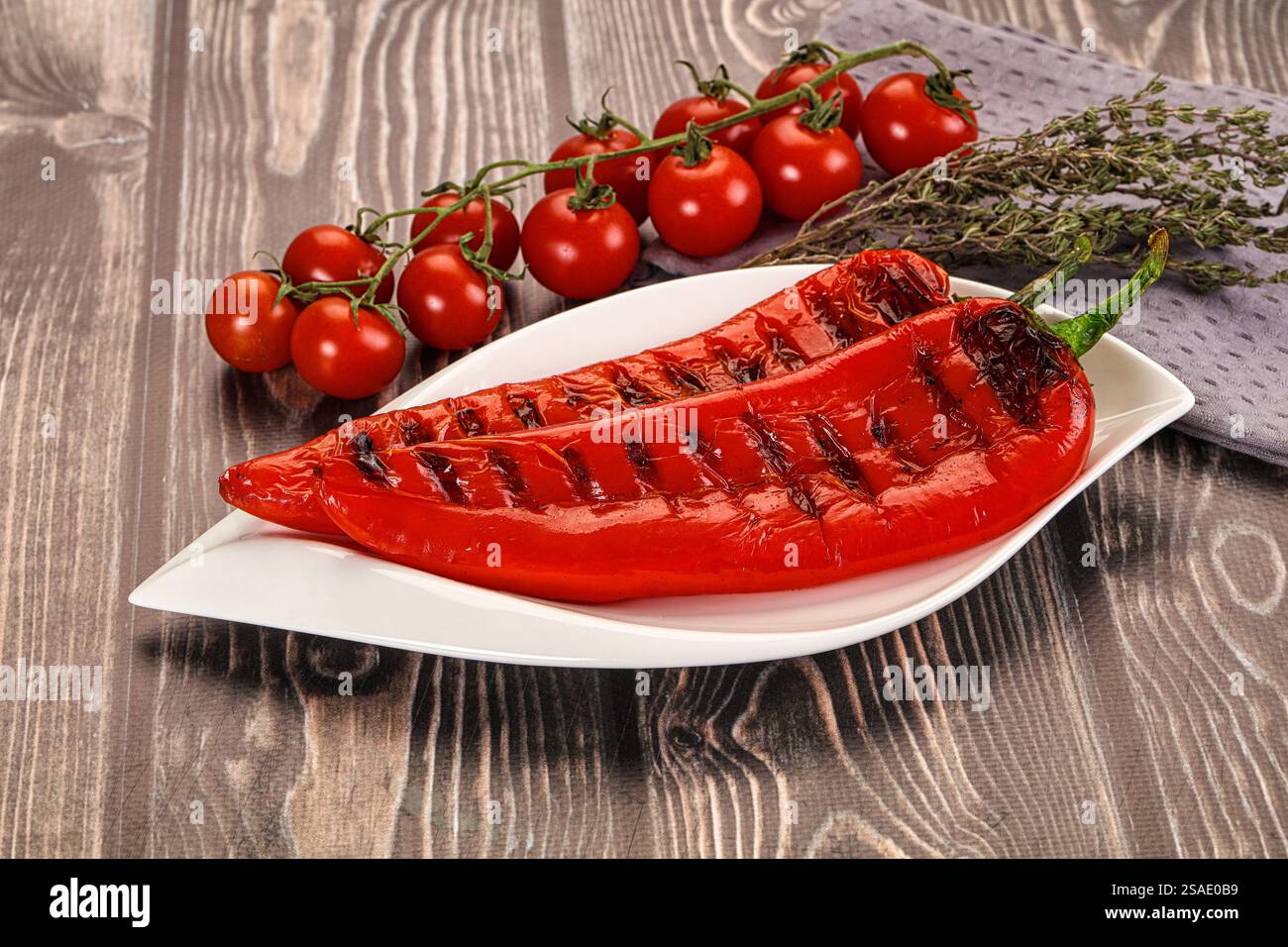 Grilled whole red paprika ramiro pepper Stock Photo - Alamy