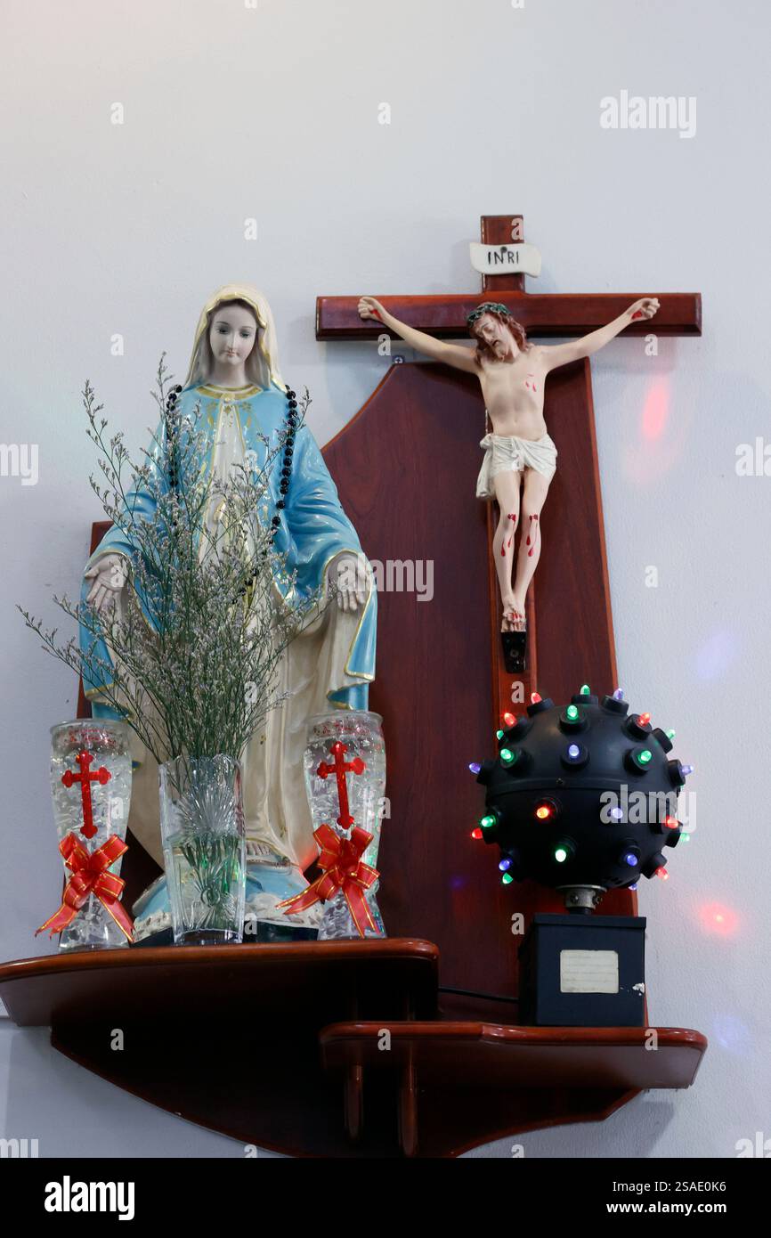Small religious altar in a private house. Virgin Mary and Jesus on the ...