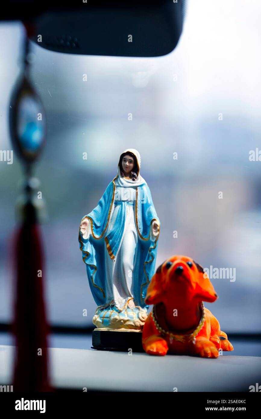 Virgin Mary figurine in a car. Good luck charm. Ho Chi Minh City ...