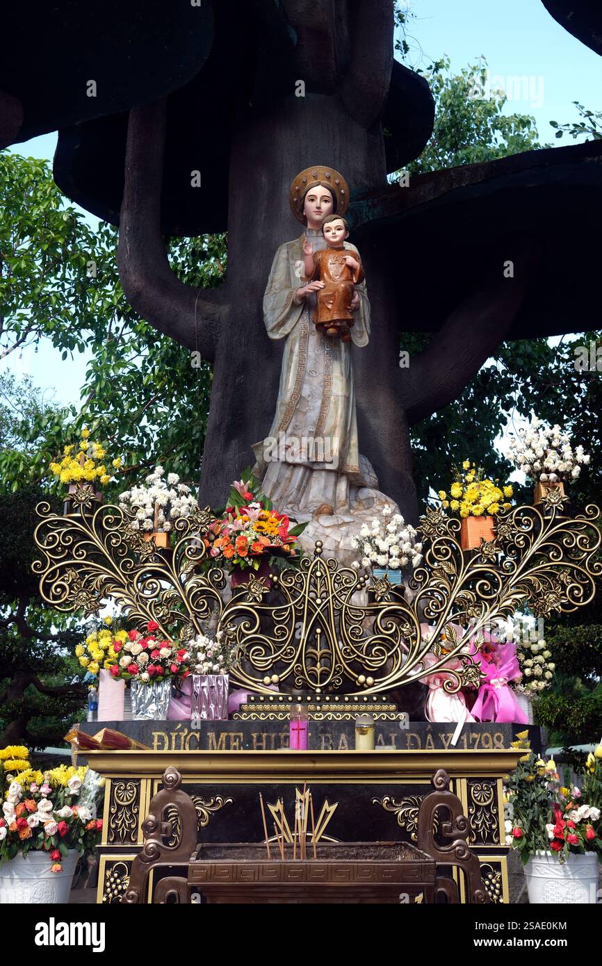 Basilica of Our Lady of La Vang. Our Lady of La Vang holding a figure ...