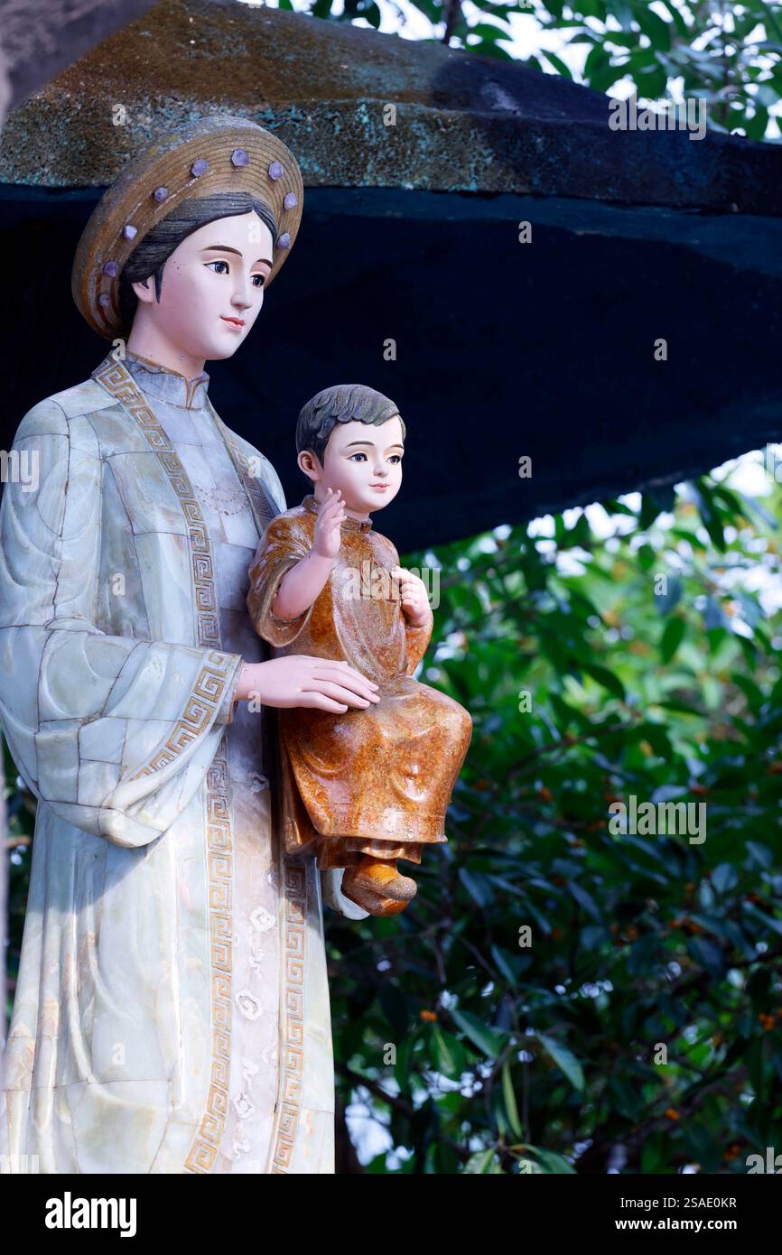 Basilica of Our Lady of La Vang. Our Lady of La Vang holding a figure ...