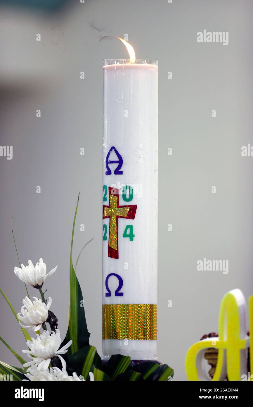 Basilica of Our Lady of La Vang. Catholic mass. Easter candle or ...