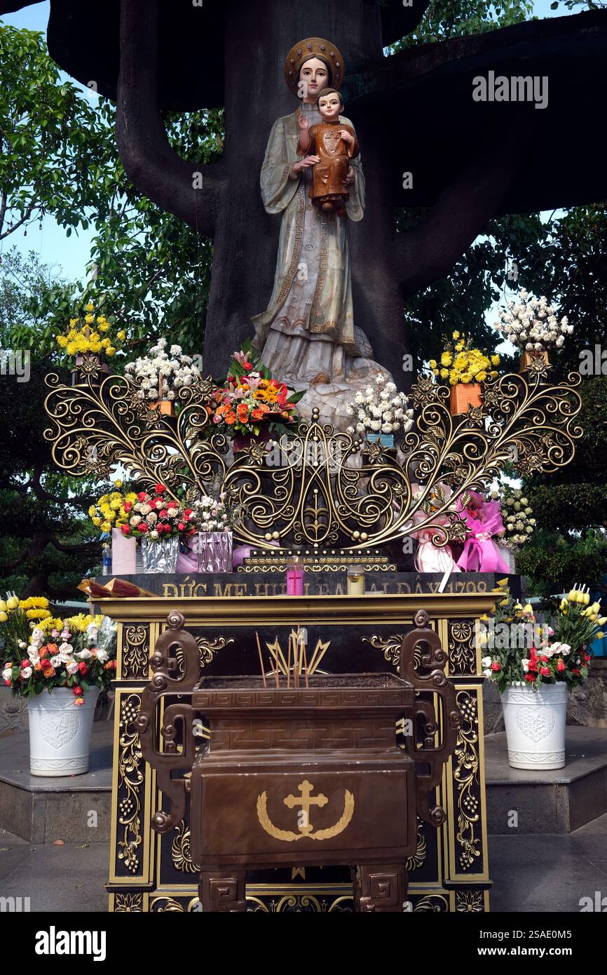 Basilica of Our Lady of La Vang. Our Lady of La Vang holding a figure ...