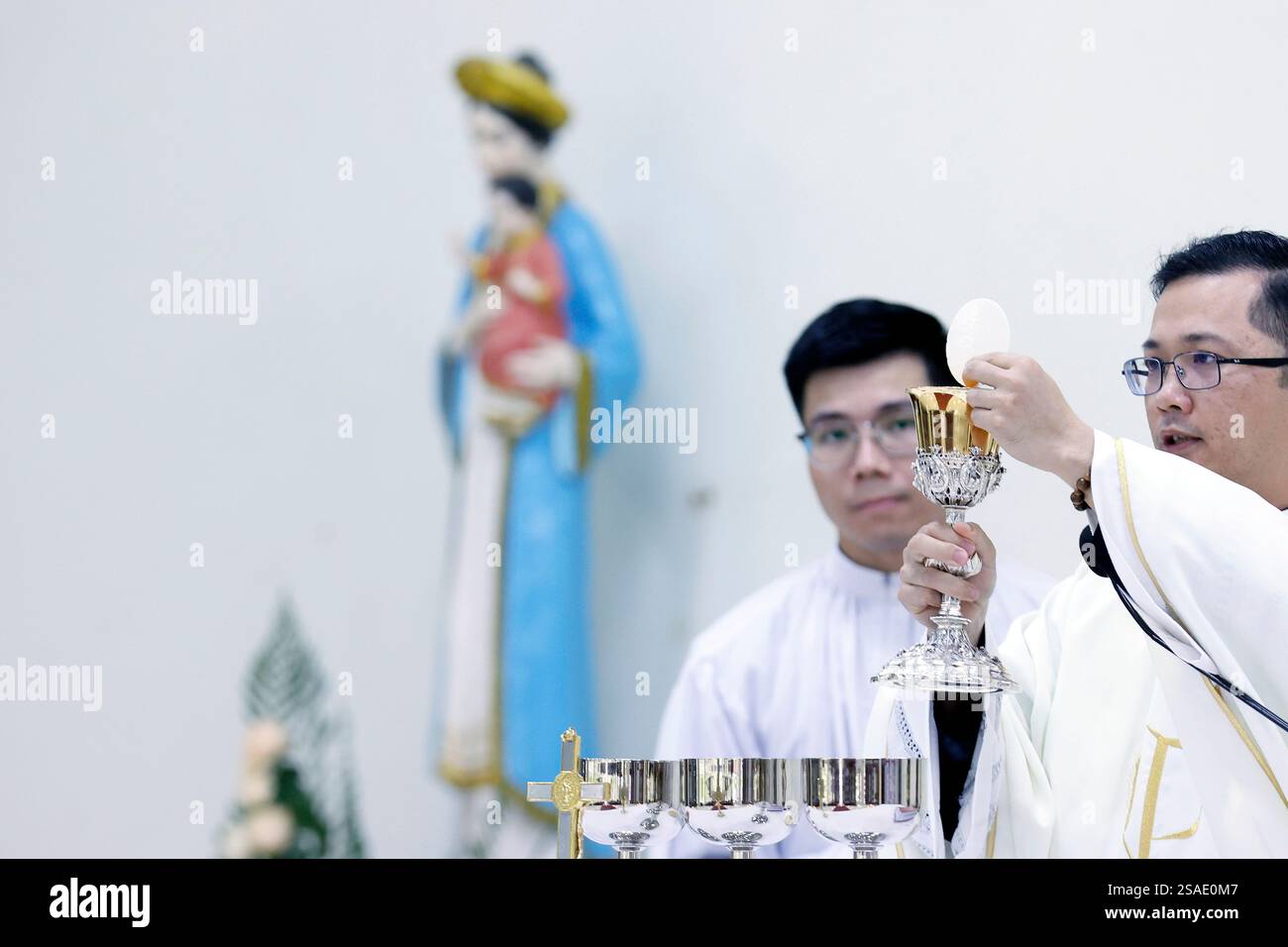 Basilica of Our Lady of La Vang. Catholic mass. Priest celebrating the ...