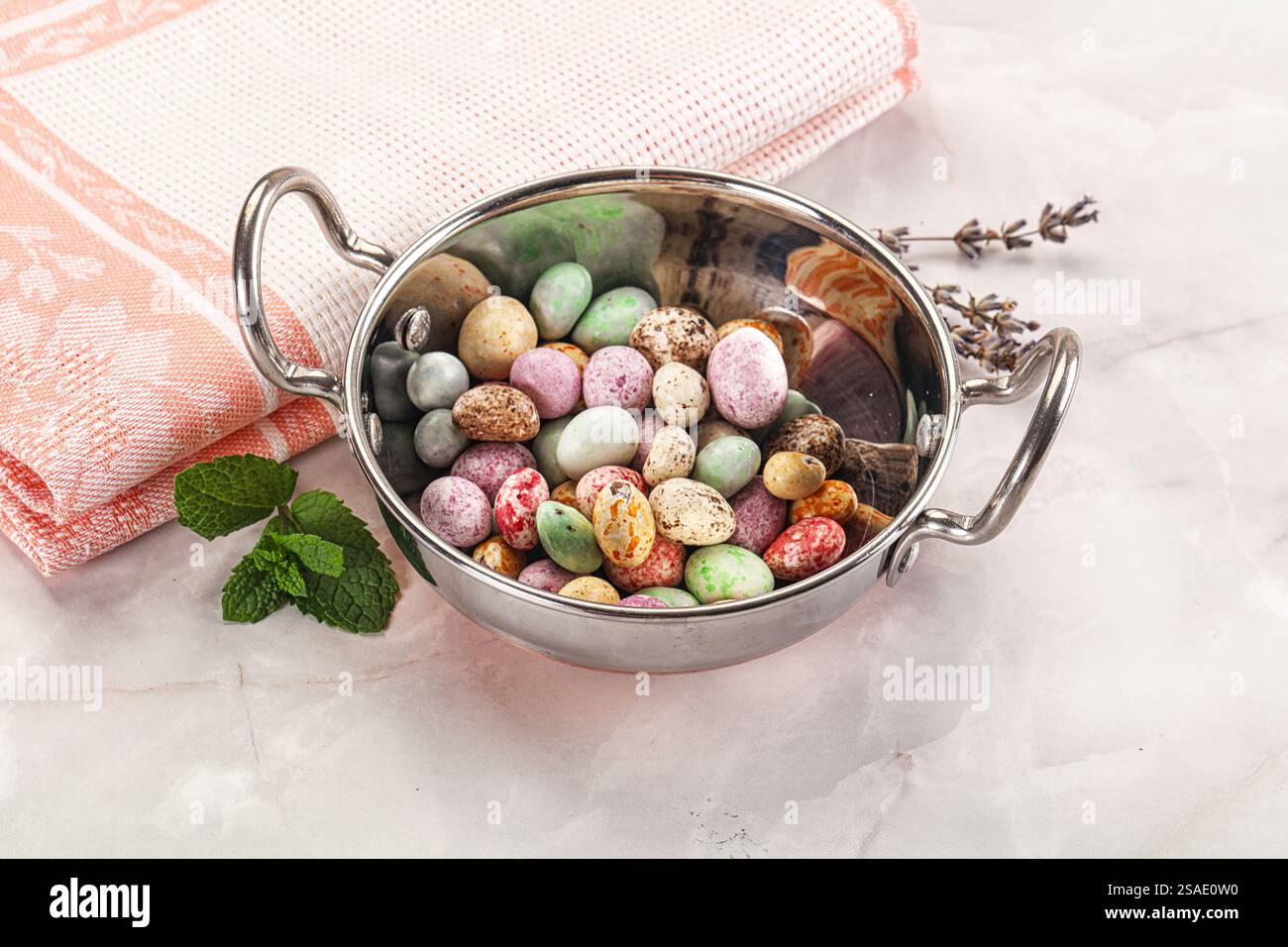 Sweet glazed peanut candy heap in the bowl Stock Photo - Alamy