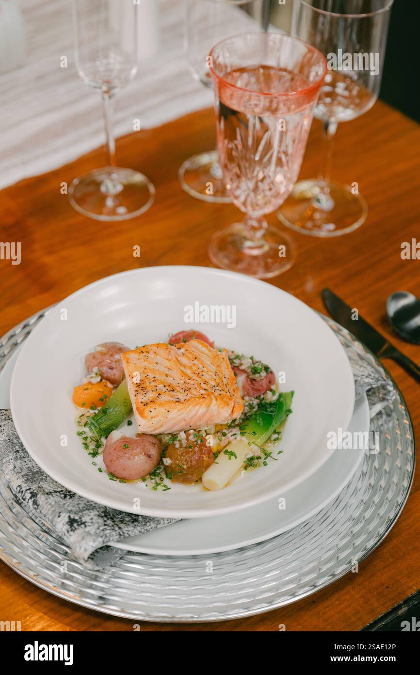 A beautifully plated salmon dish features a perfectly cooked fillet ...