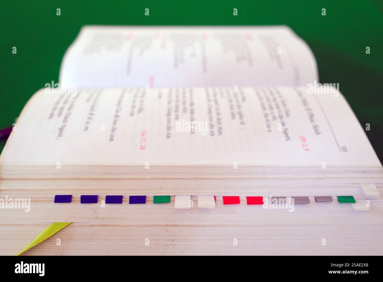 Open Bible with bookmarks on a church altar Stock Photo - Alamy