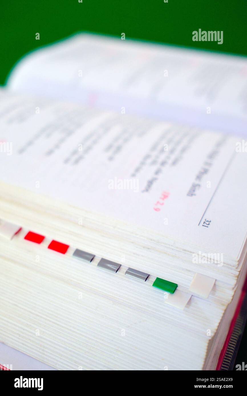 Open Bible with bookmarks on a church altar Stock Photo - Alamy